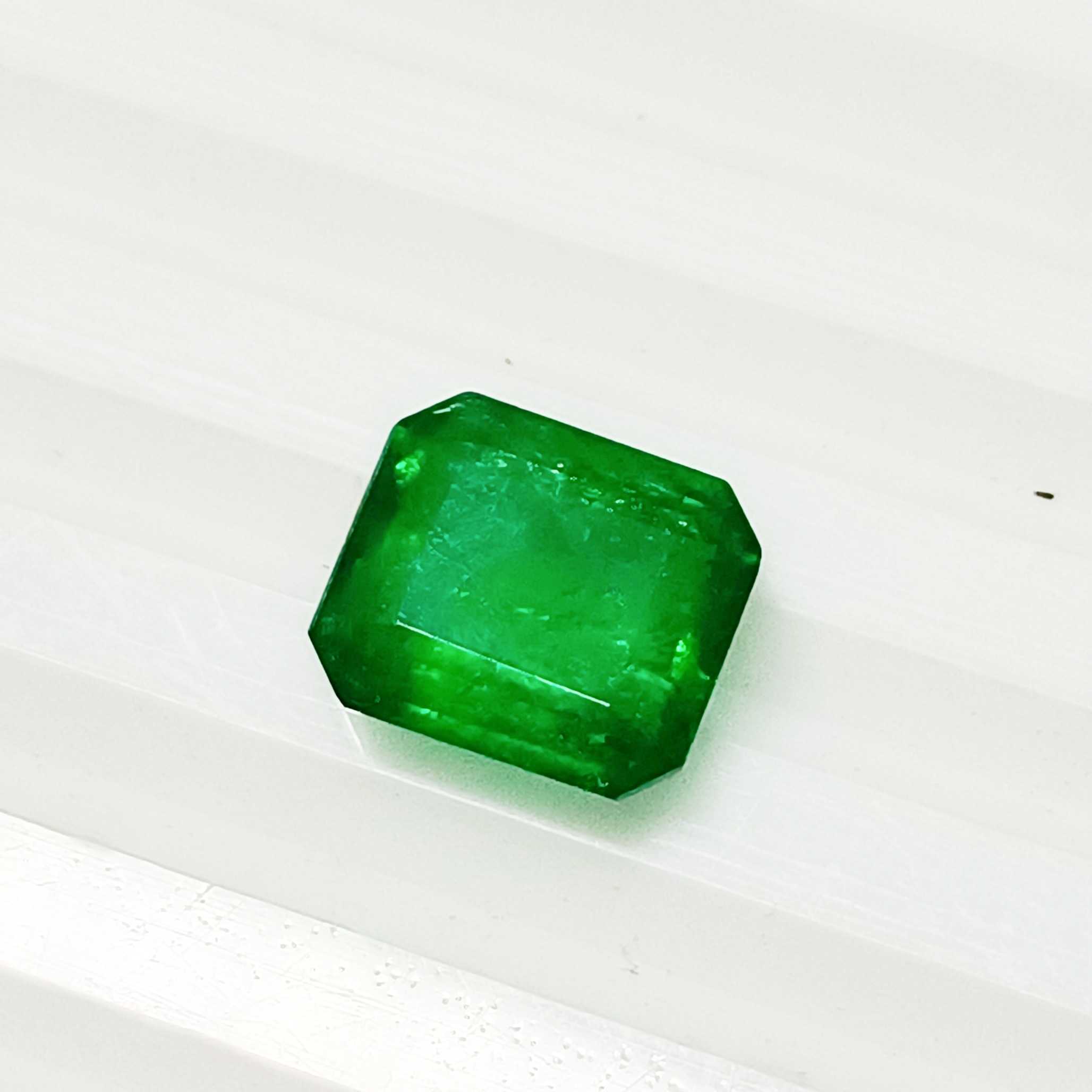 Jewel Fields - 2.35ct octagon step cut neon green color emerald