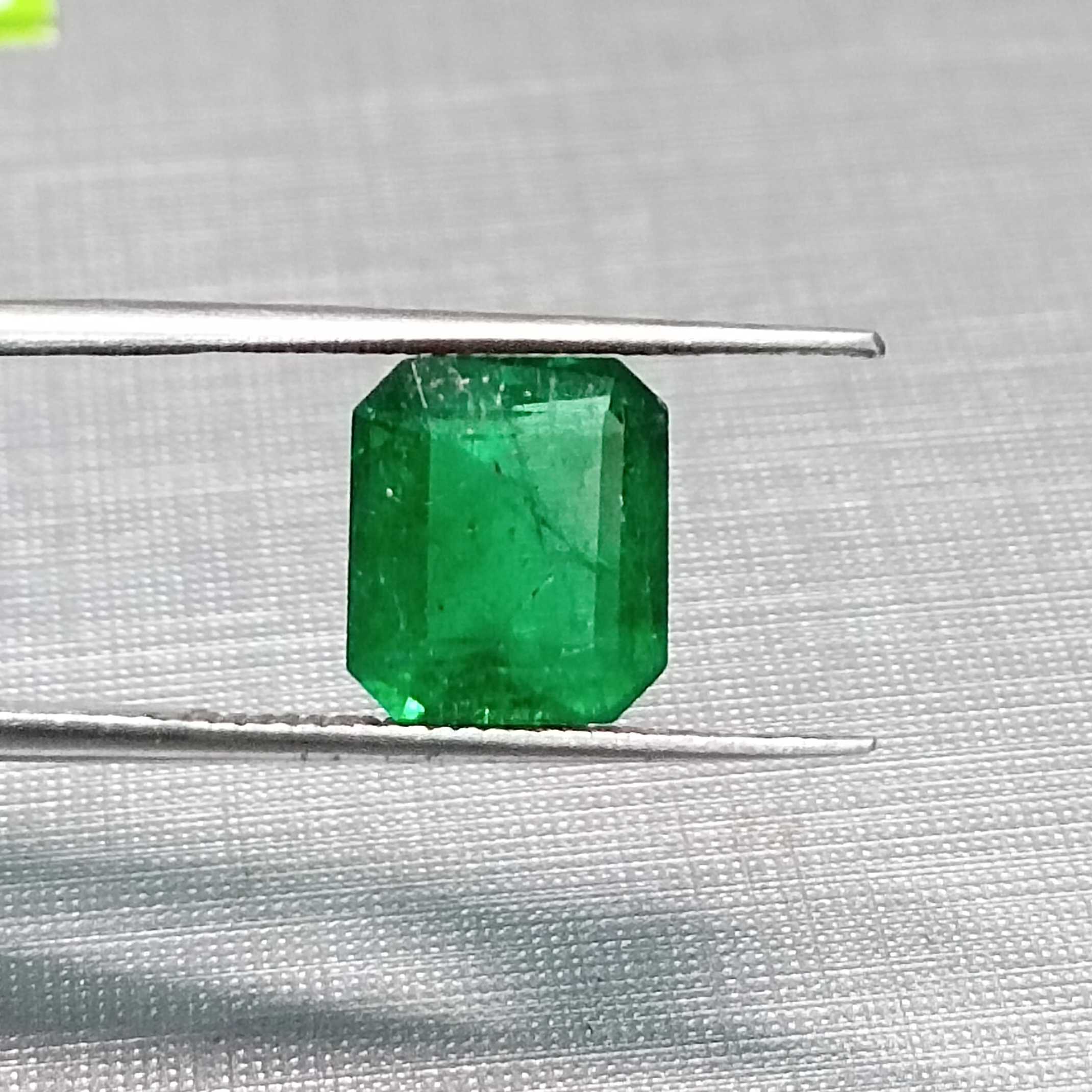 Jewel Fields - 2.35ct octagon step cut neon green color emerald