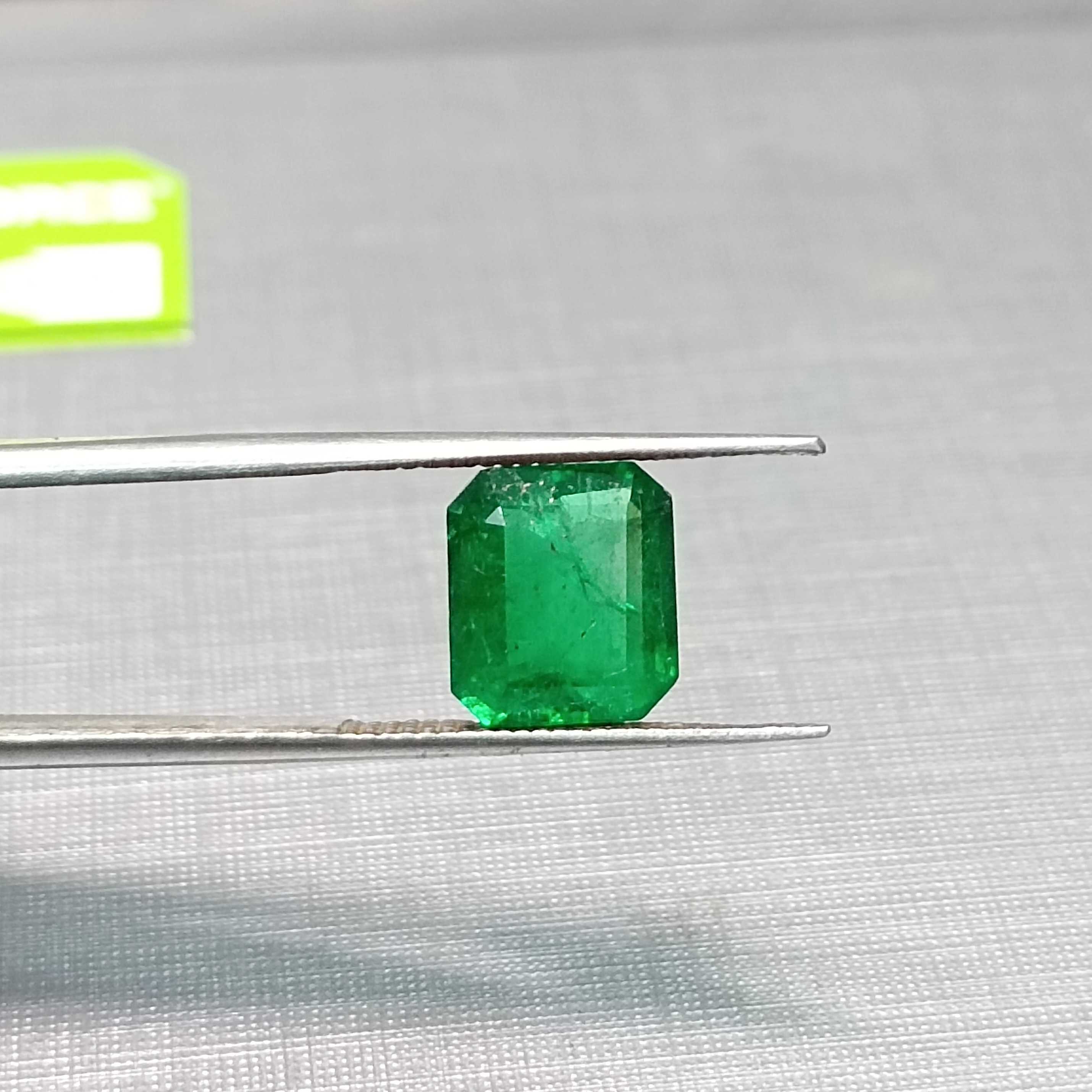 Jewel Fields - 2.35ct octagon step cut neon green color emerald